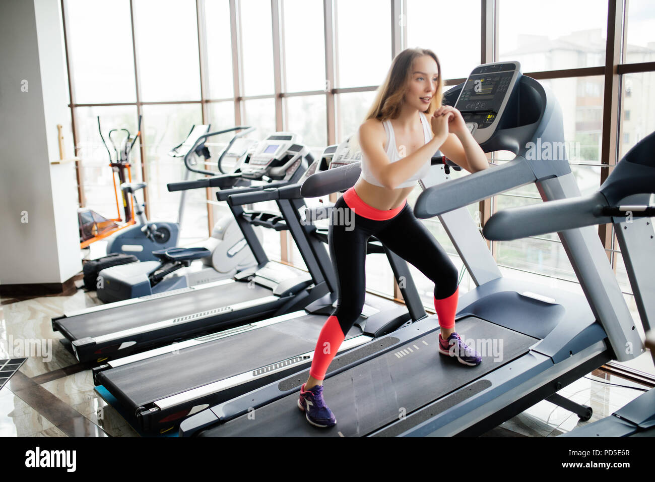 Young girl makes exercises at the gym Stock Photo - Alamy