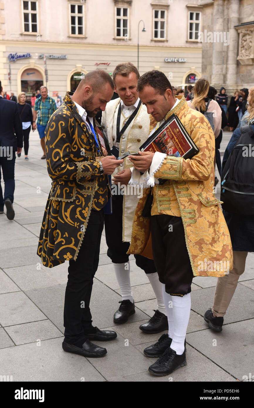Mozart opera guide and ticket agents in costume Vienna, Austria Stock ...