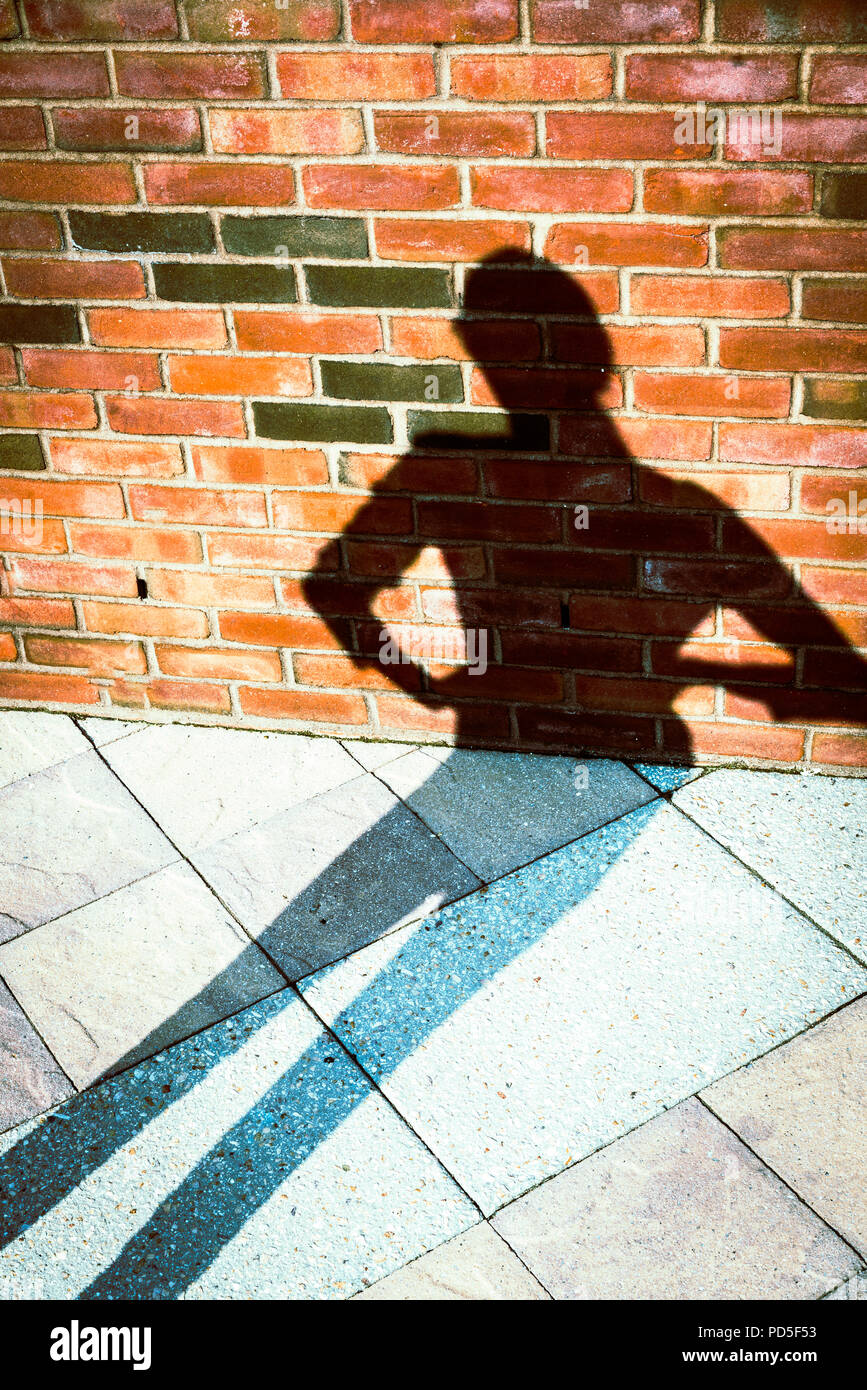 Shadow only in front of brick wall Stock Photo - Alamy