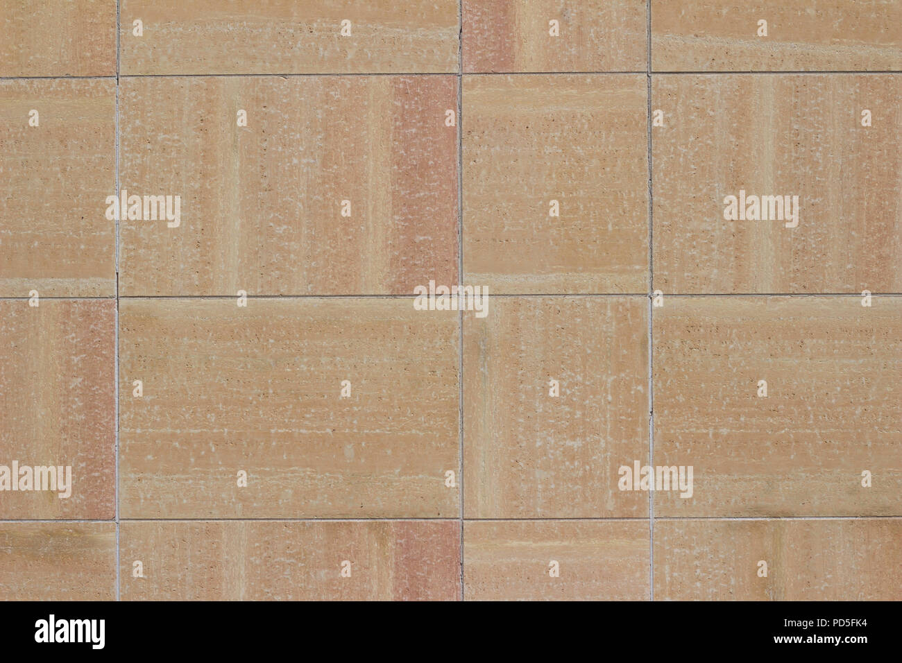 Attractive tile block stone wall background with striated blocks in ...