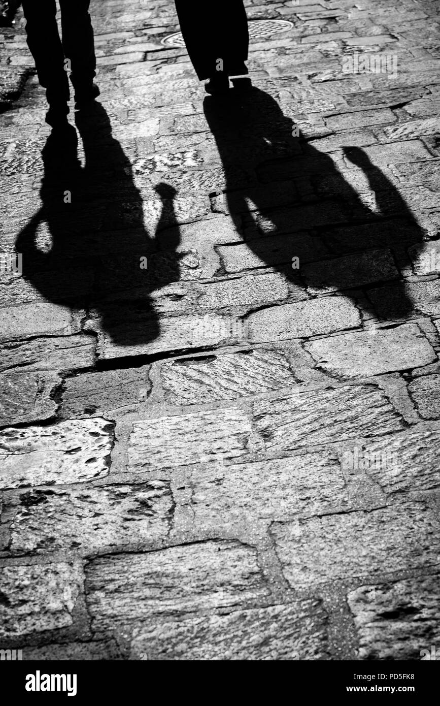 People shadows on pavement, San Miguel de Allende, a colonial-era city ...