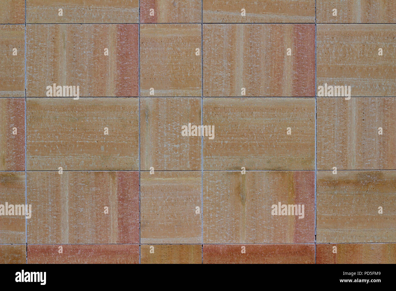 Attractive tile block stone wall background with striated blocks in ...