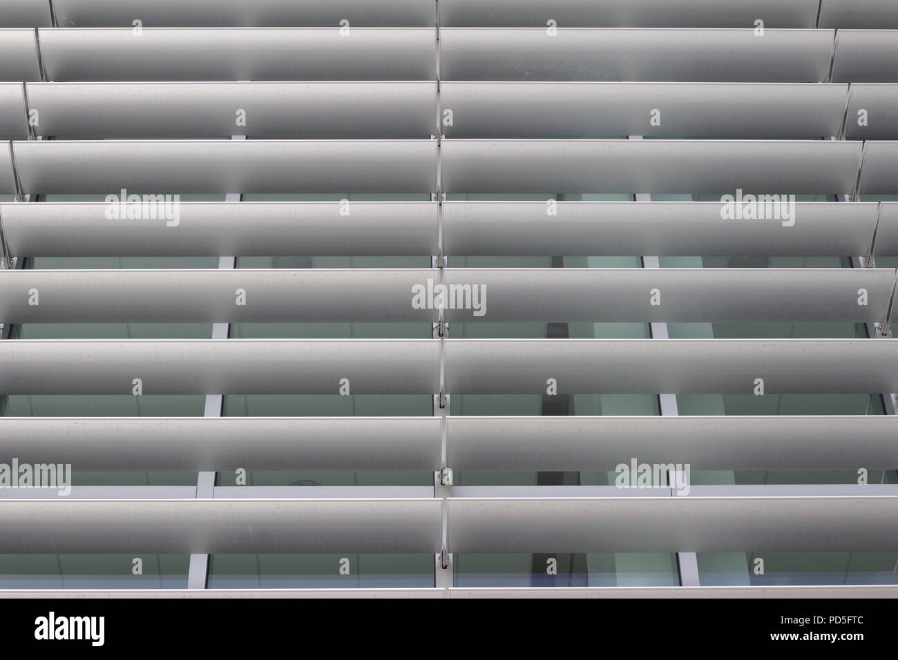 Low angle view of energy efficient window louvers on a tall building ...