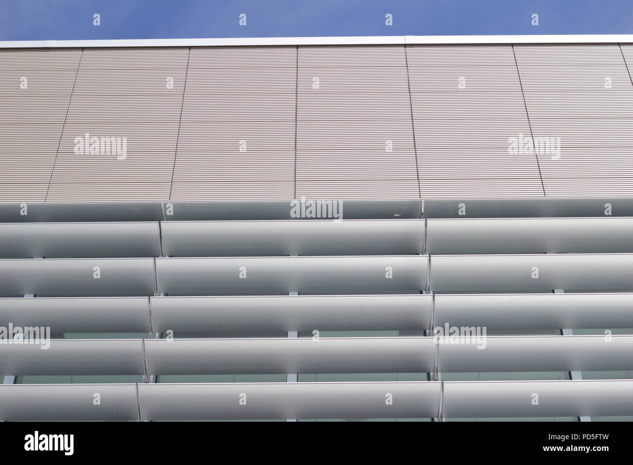 Low angle view of energy efficient window louvers on a tall building ...