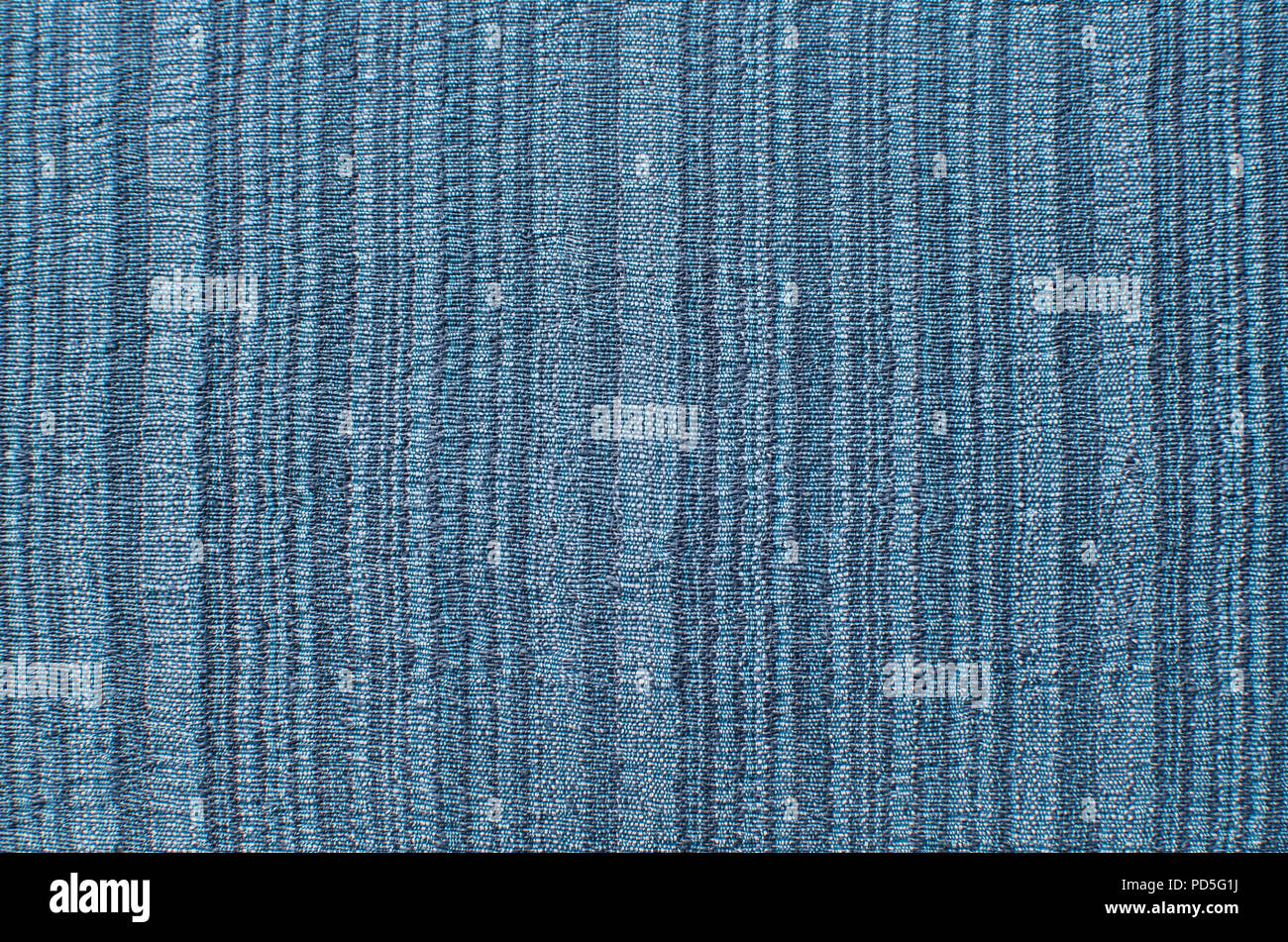 Silk and linen blue color natural fabric texture closeup as textile ...