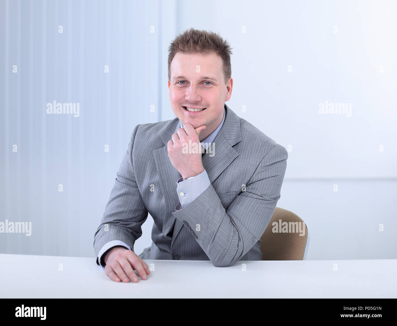 Boss sitting behind desk standing hi-res stock photography and images ...