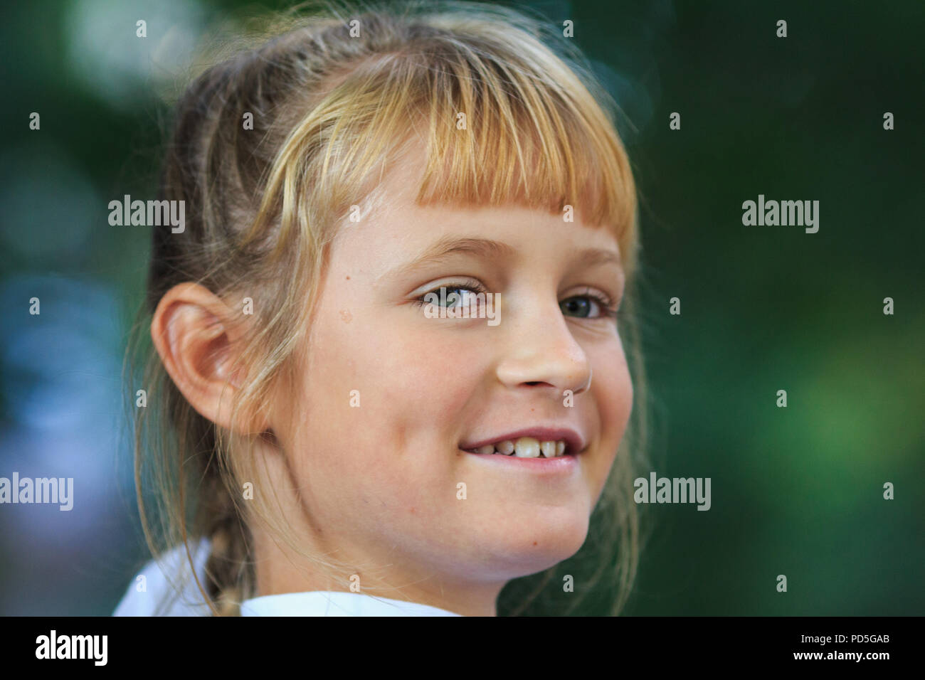 little girl's face closeup, kid's portrait, smiling child Stock Photo ...