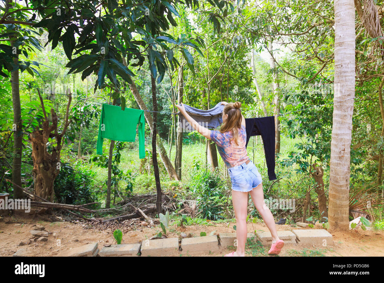 Mature woman hanging out washing hi-res stock photography and images ...