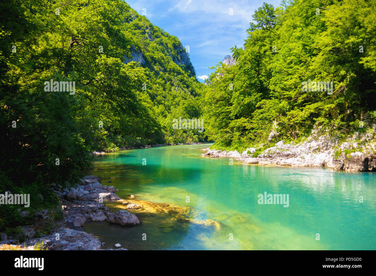 blue river flows in the picturesque mountains Stock Photo - Alamy
