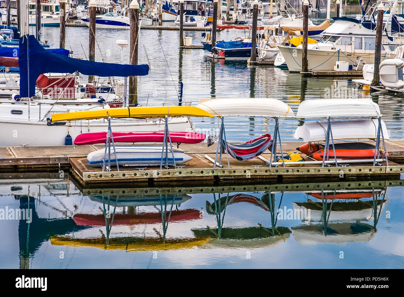 Small Boats in Rack at Pier Stock Photo - Alamy