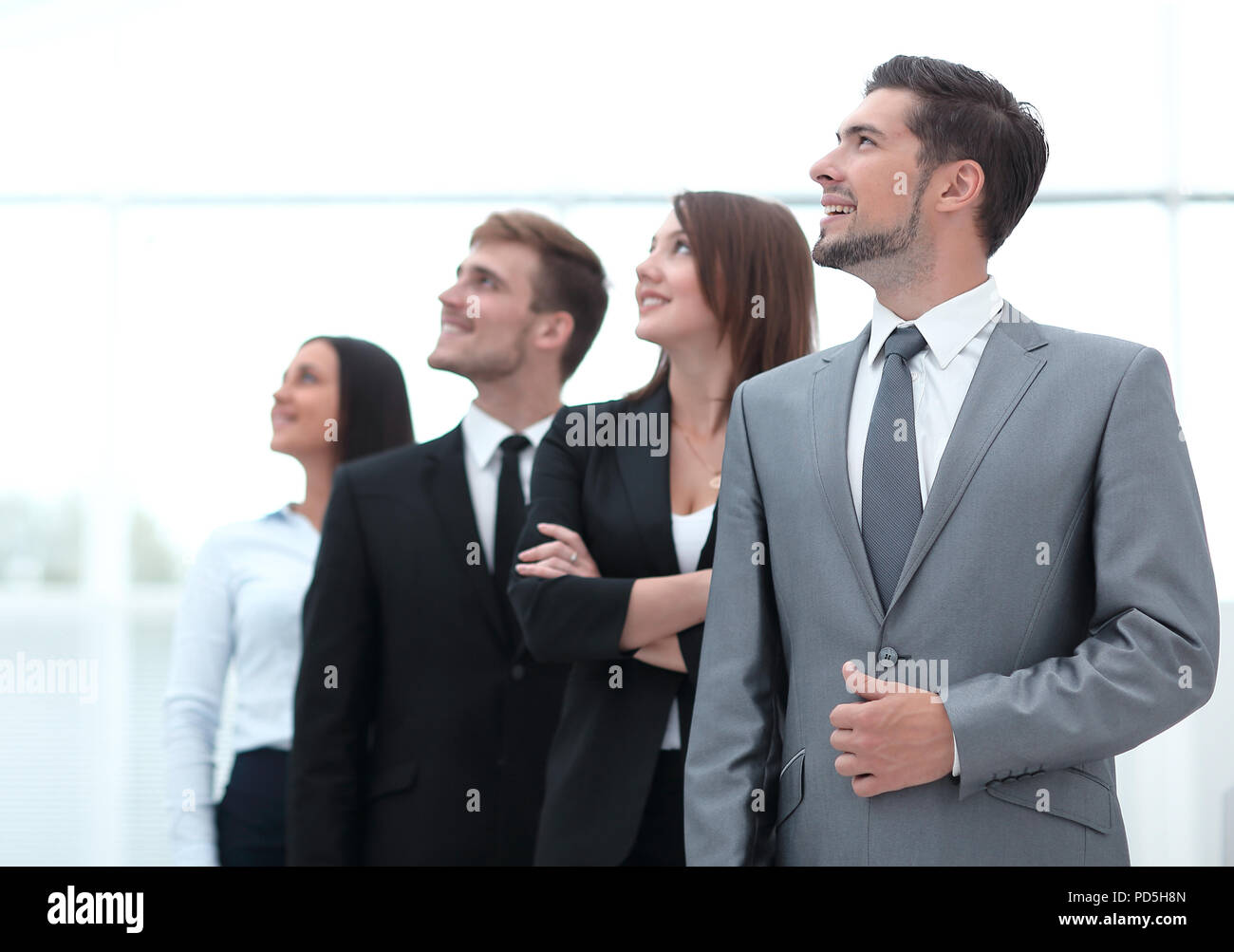 Manager standing behind employees hi-res stock photography and images ...