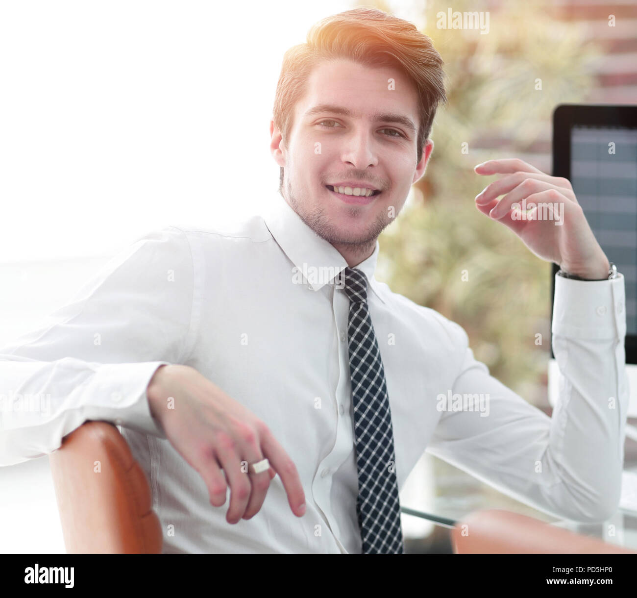 employee sitting in front of a computer screen Stock Photo - Alamy