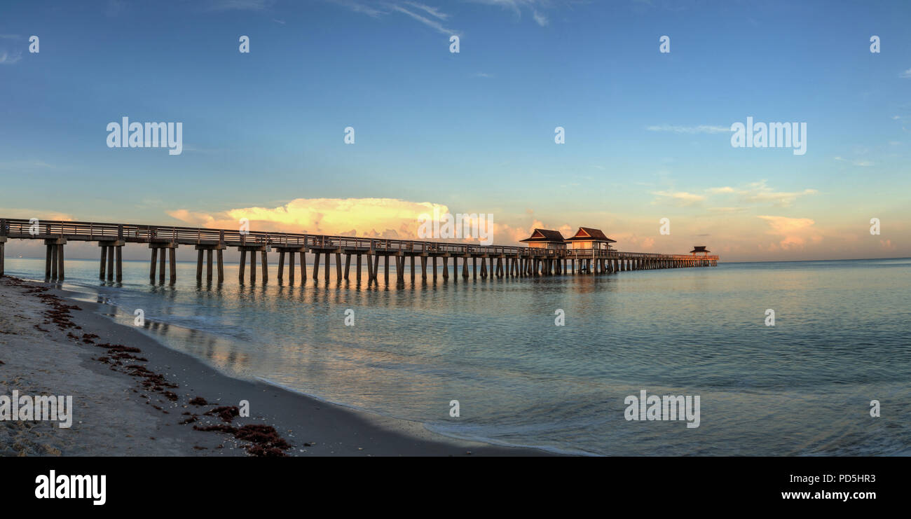 Early sunrise over the Naples Pier on the Gulf Coast of Naples, Florida ...