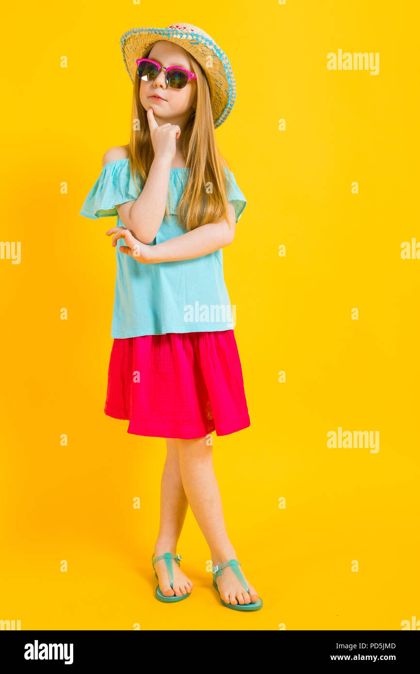 Girl with red hair on a yellow background. A charming girl in bright ...