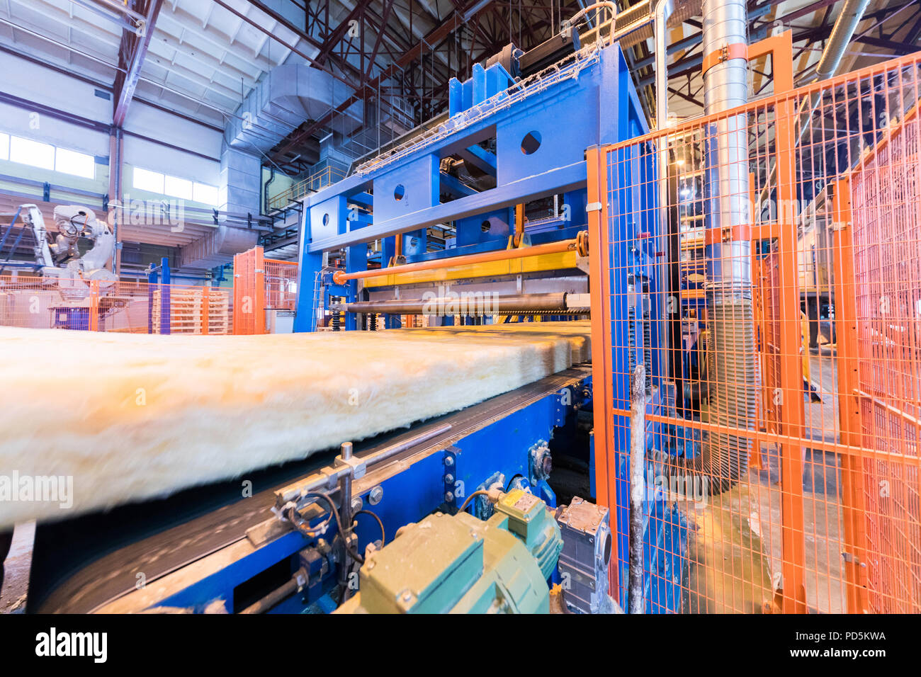 Fiberglass production industry equipment at manufacture background ...