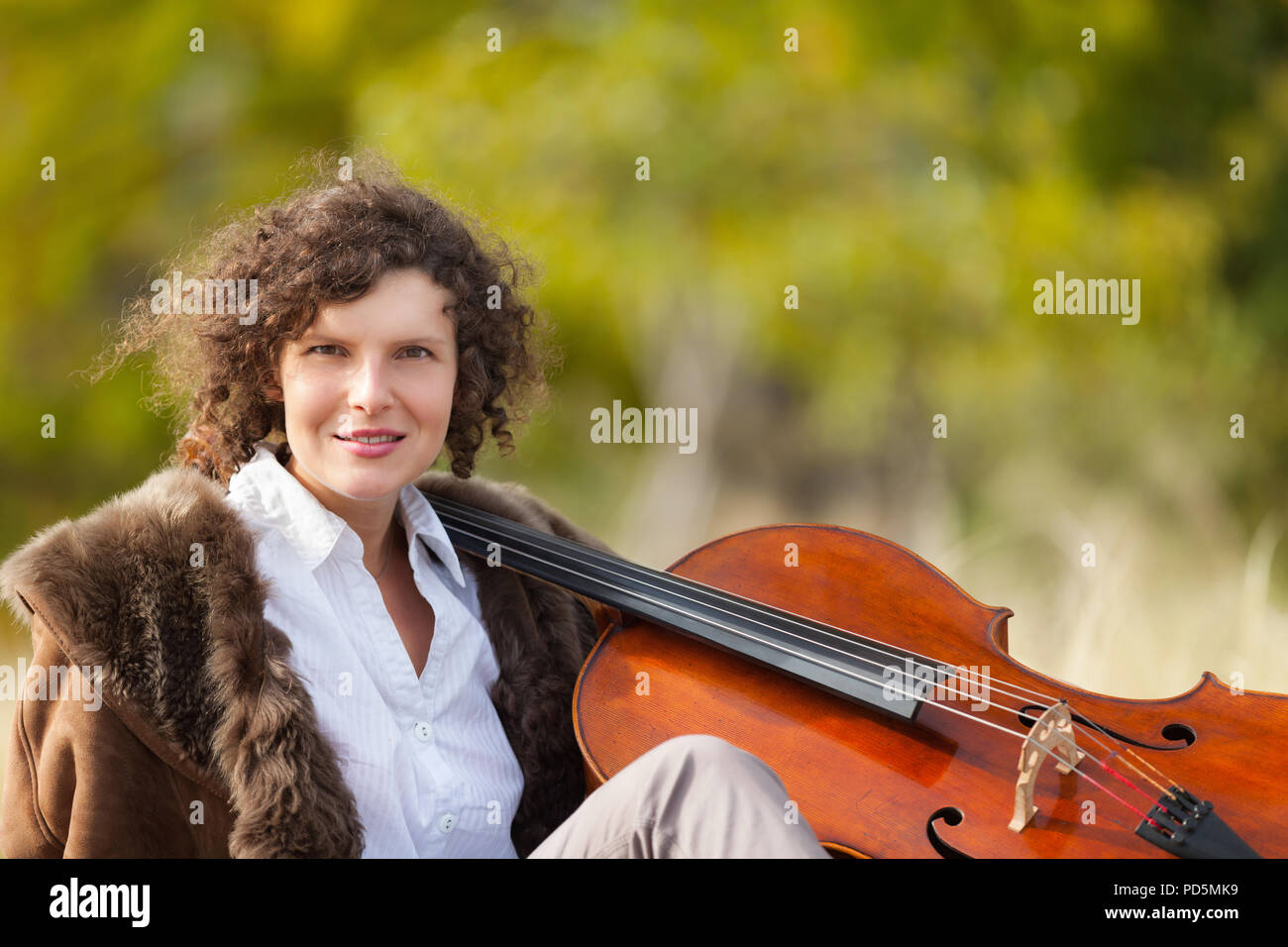 Portrait of young cellist, outdoors Stock Photo - Alamy