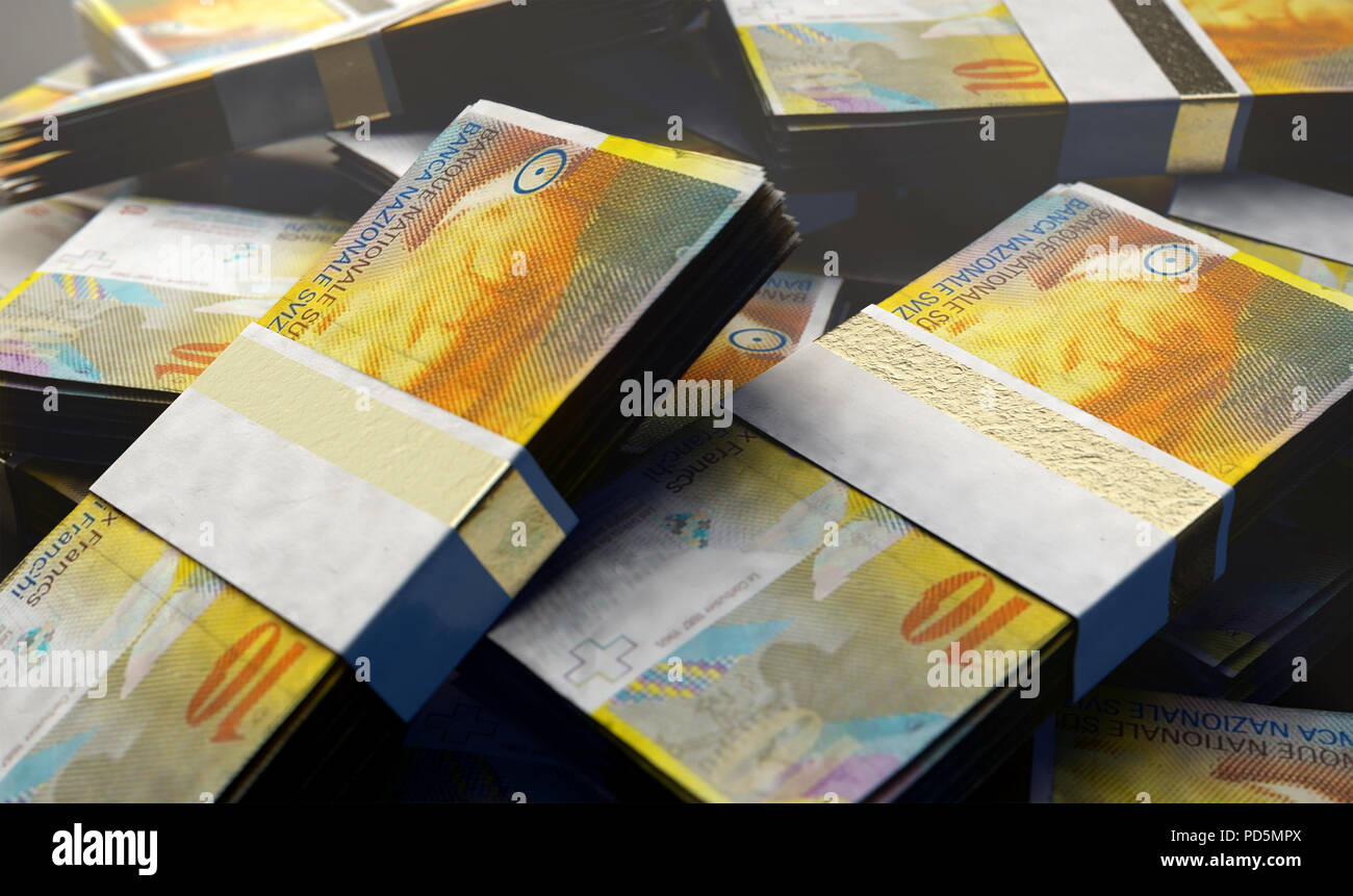 A pile of randomly scattered bundles of swiss franc banknotes on an ...