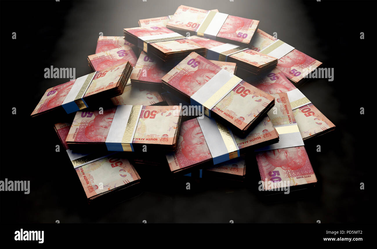 A pile of randomly scattered bundles of south african rand banknotes on ...