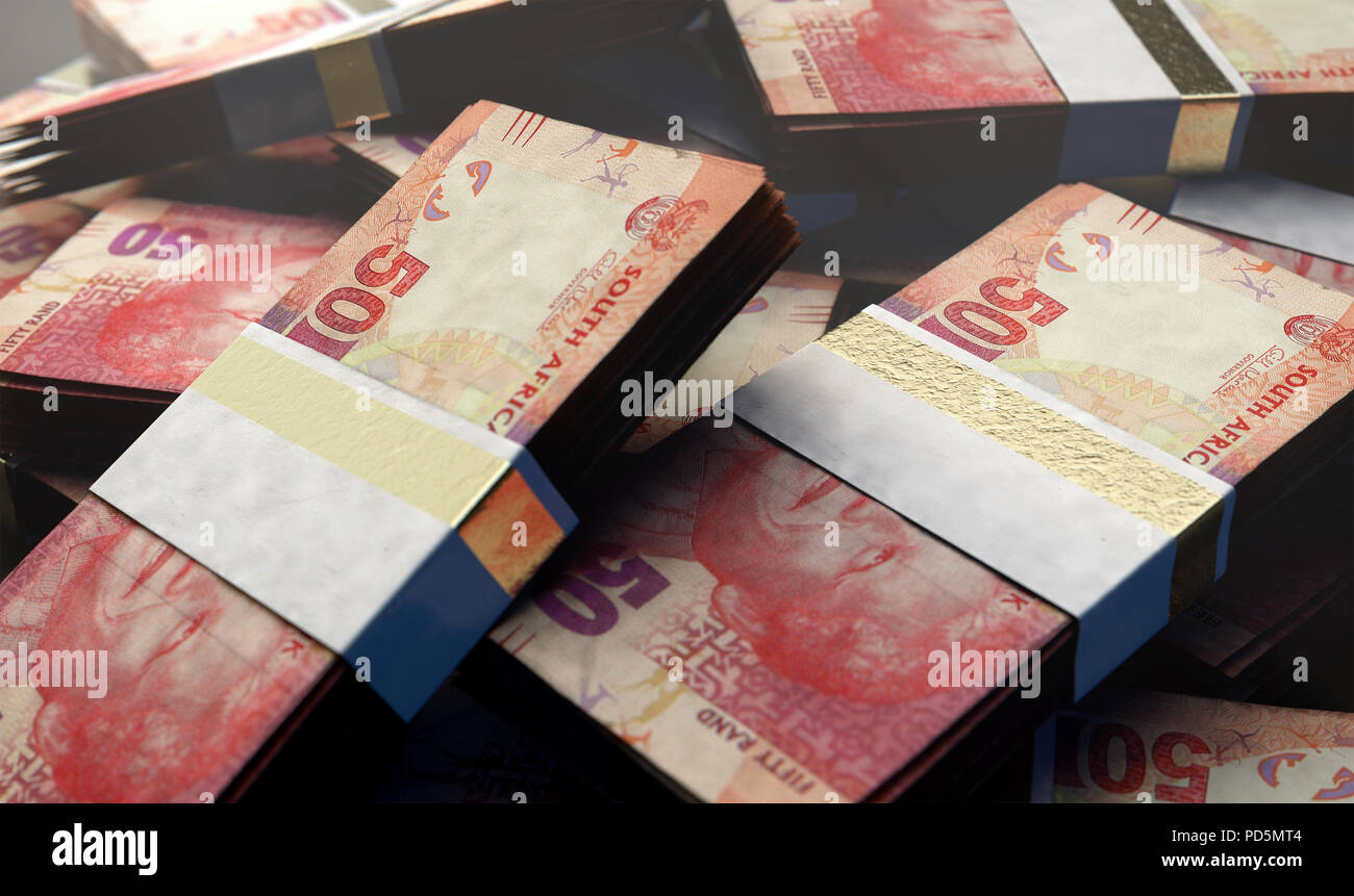 A pile of randomly scattered bundles of south african rand banknotes on ...