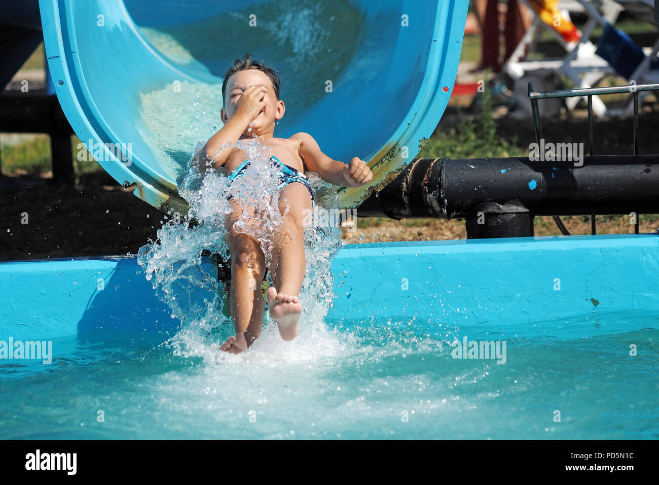 Boy water slide hi-res stock photography and images - Alamy