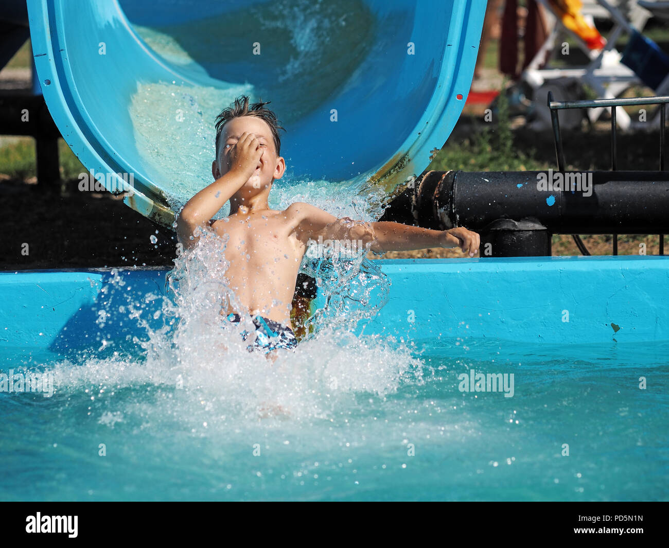 Boy water slide hi-res stock photography and images - Alamy