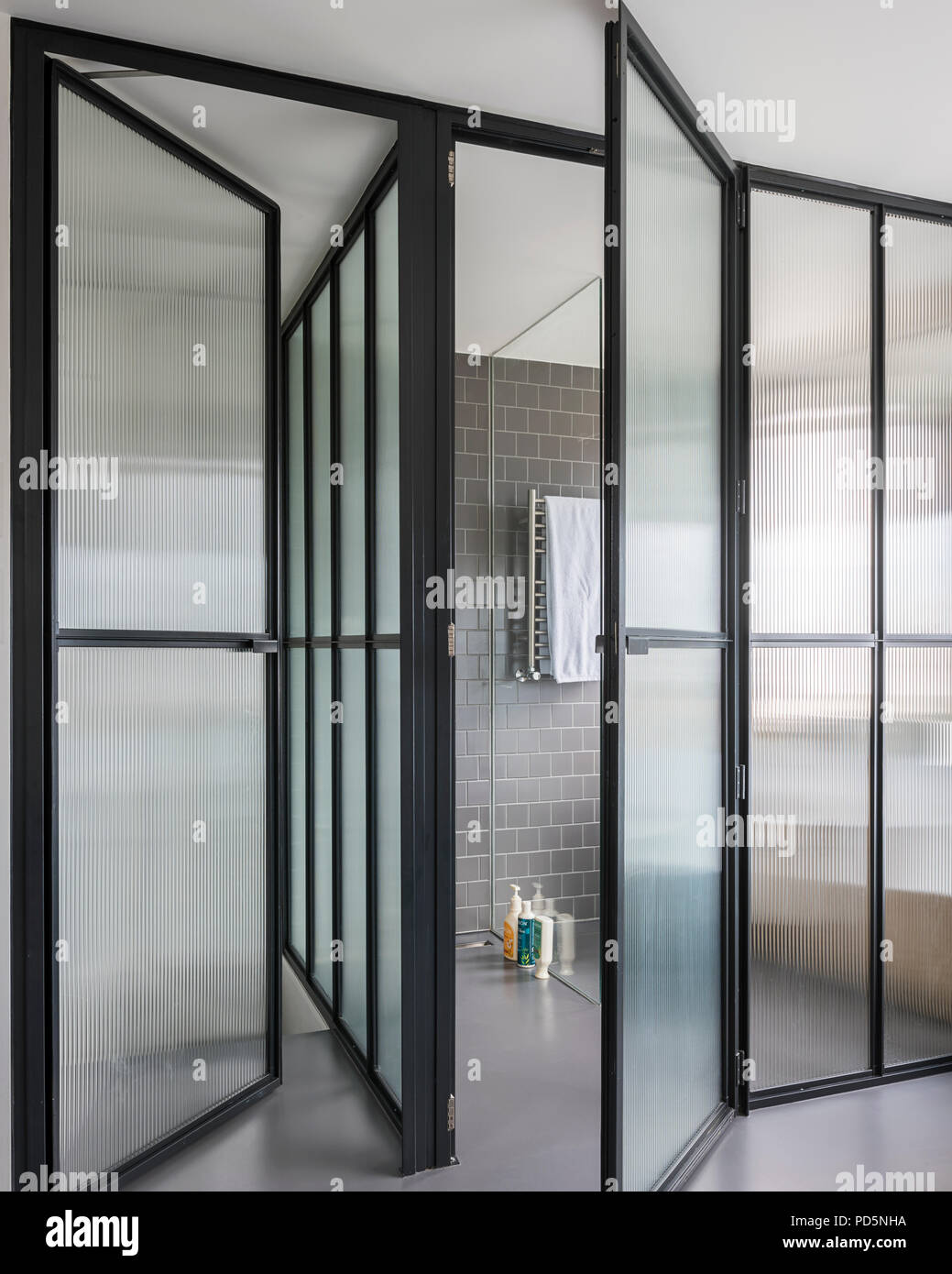 Corrugated glass panels in wet room Stock Photo - Alamy