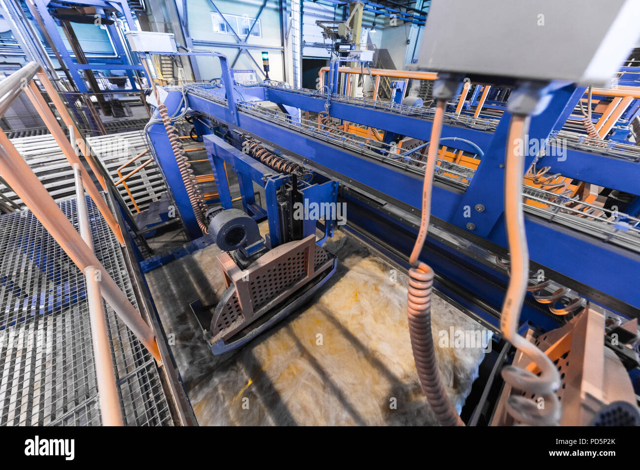 Fiberglass production industry equipment at manufacture background ...