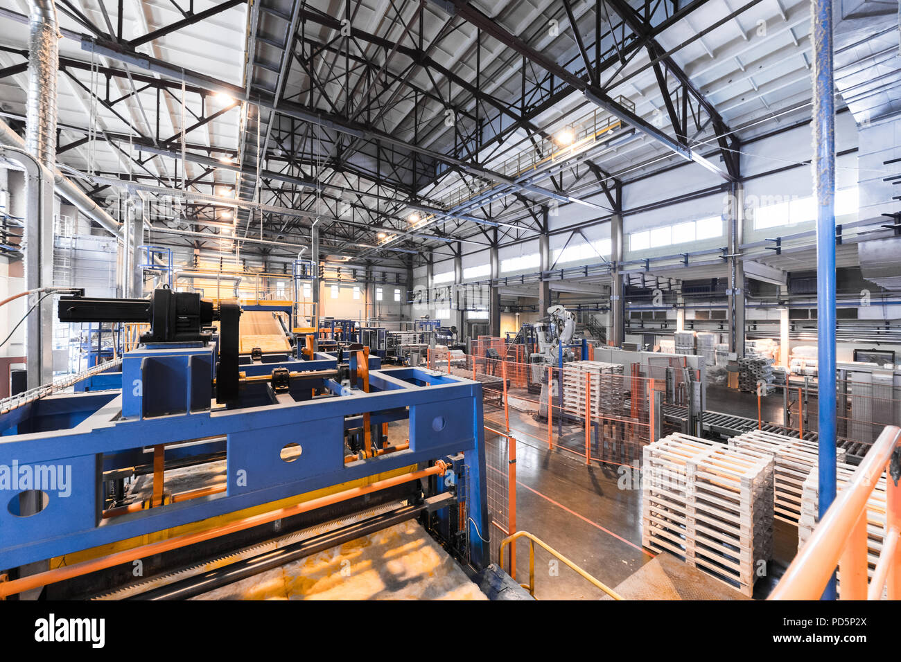 Fiberglass production industry equipment at manufacture background ...