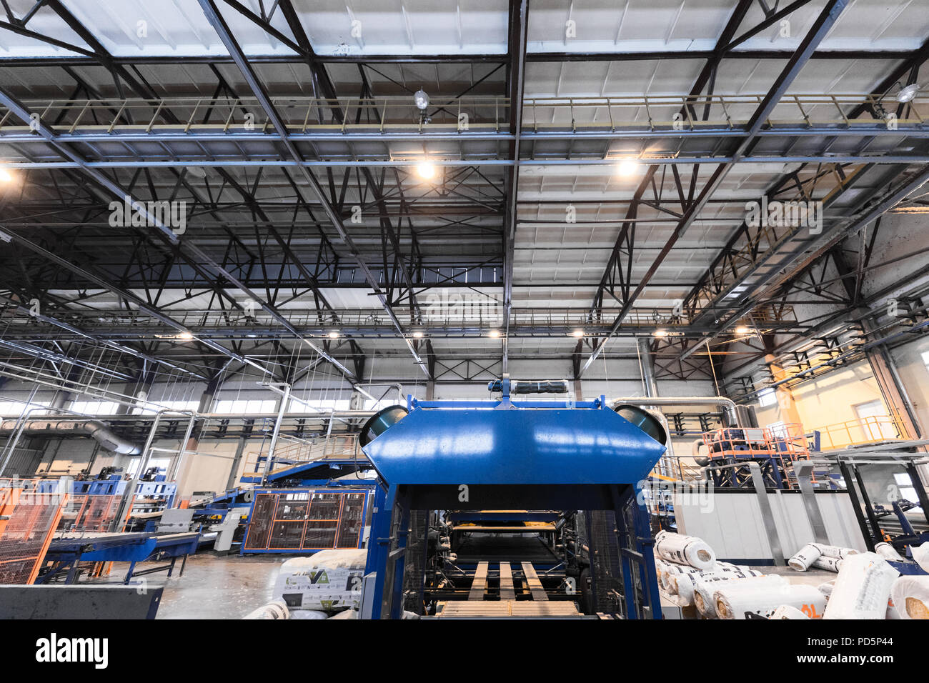 Fiberglass production industry equipment at manufacture background ...