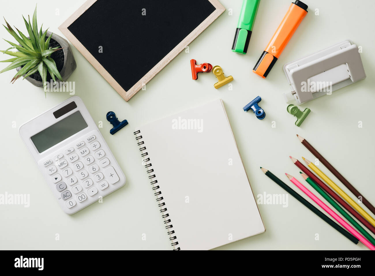 Business concept: stapler,markers, magnifier, cutter, tape, pen, pencil ...