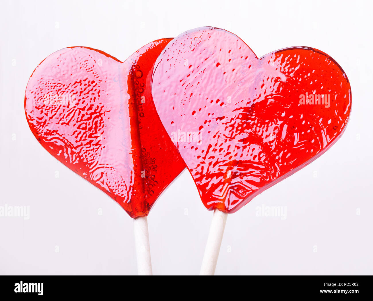 Two candy heart shape on white background Stock Photo - Alamy