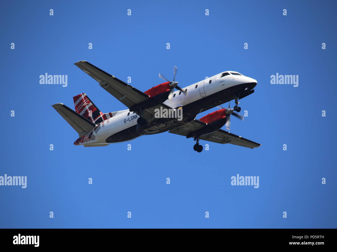 Loganair Saab 340 plane on final approach to Edinburgh Airport Scotland ...