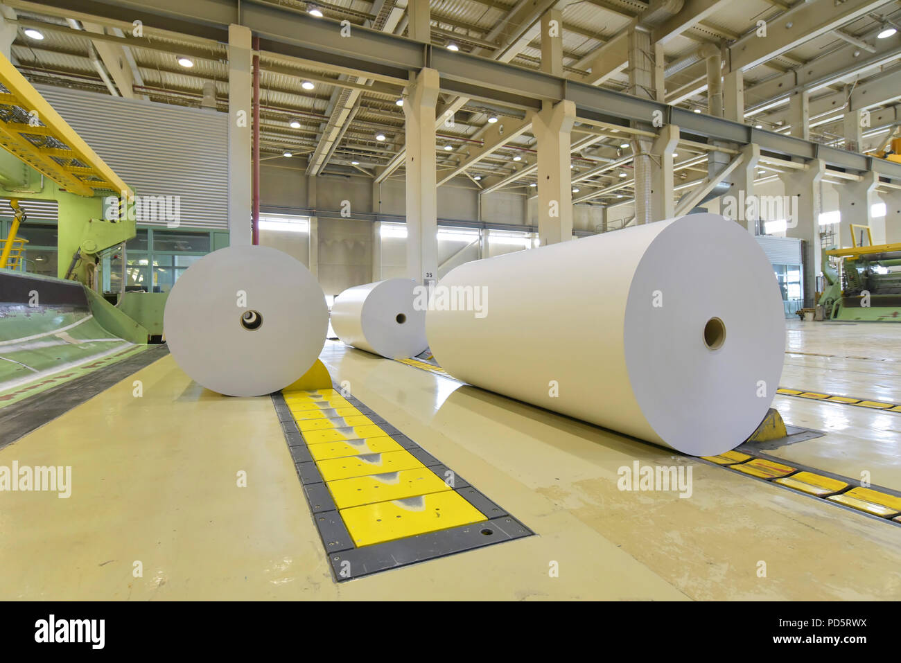 machines for the production of paper rolls for further processing in a ...