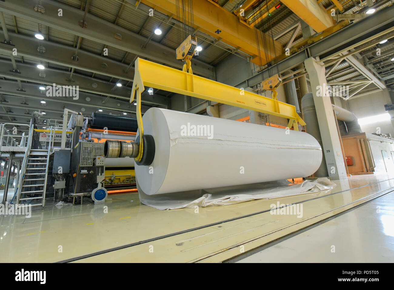 machines for the production of paper rolls for further processing in a ...