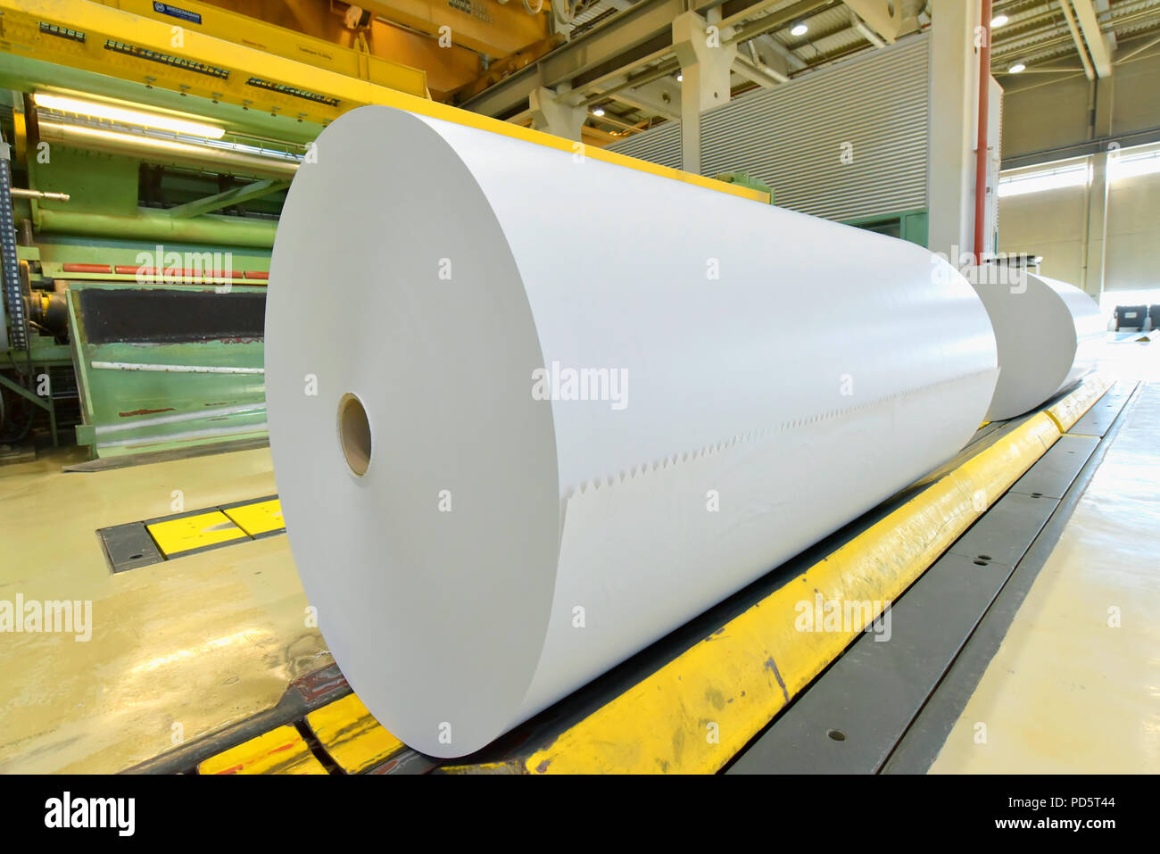 machines for the production of paper rolls for further processing in a ...
