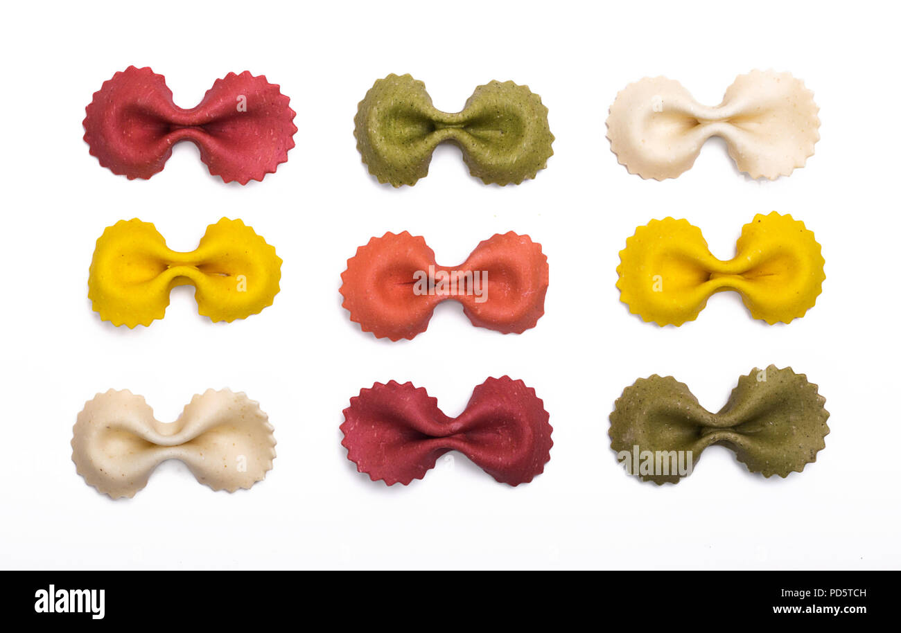 Handmade multi-colored paste in the shape of a bow on a white ...