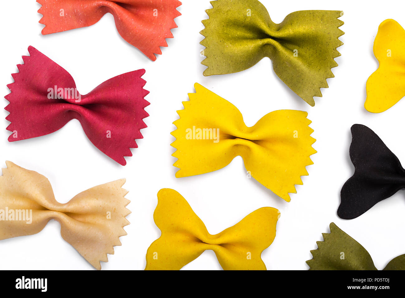 Handmade multi-colored paste in the shape of a bow on a white ...