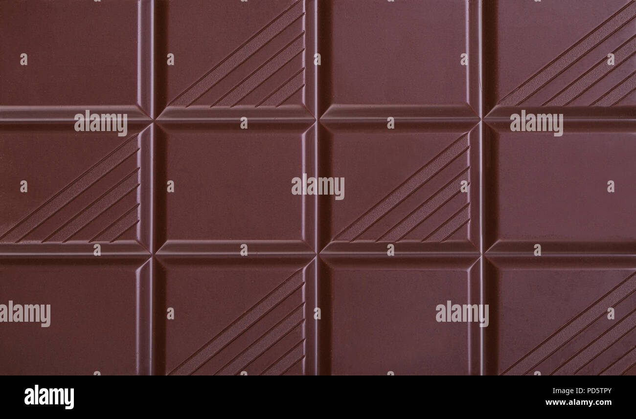 Milk chocolate bar on a black background closeup Stock Photo - Alamy