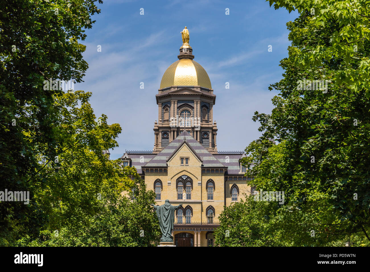 Notre Dame - Circa August 2018: Mary stands atop the Golden Dome of the ...