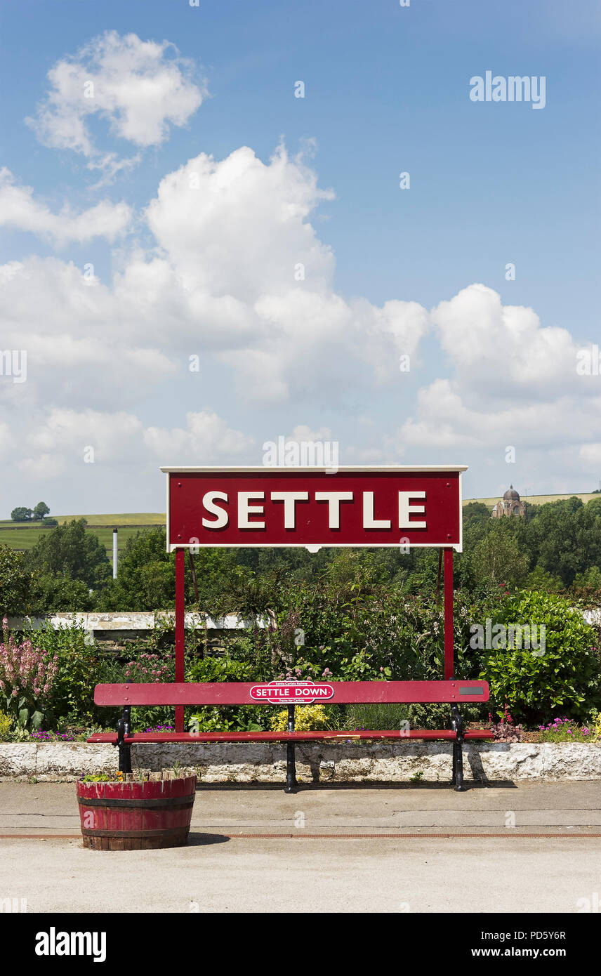 Sign and bench at Settle railway station, Yorkshire Dales, UK Stock ...