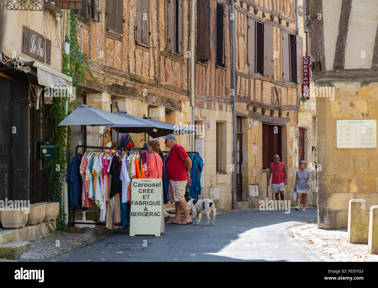 People shopping in the medieval old town section of Bergerac town ...