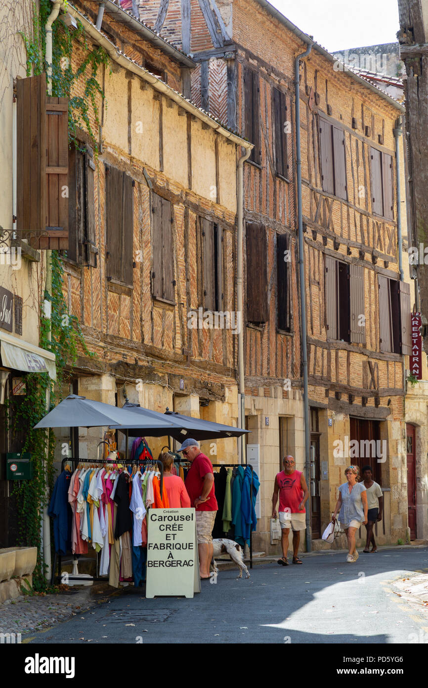 People shopping in the medieval old town section of Bergerac town ...