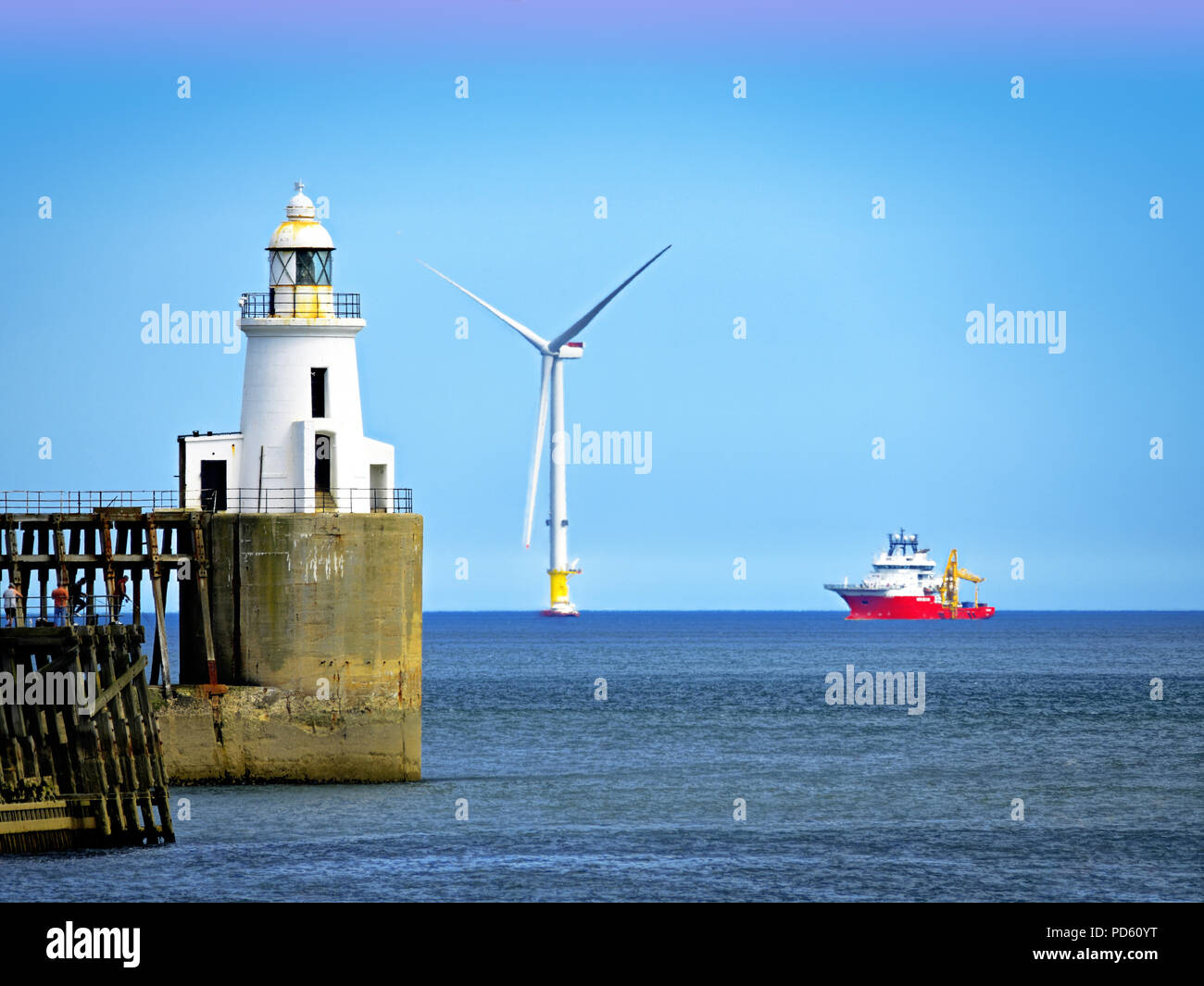 Blyth lighthouse fishermen windfarm and supply repair ship Stock Photo ...