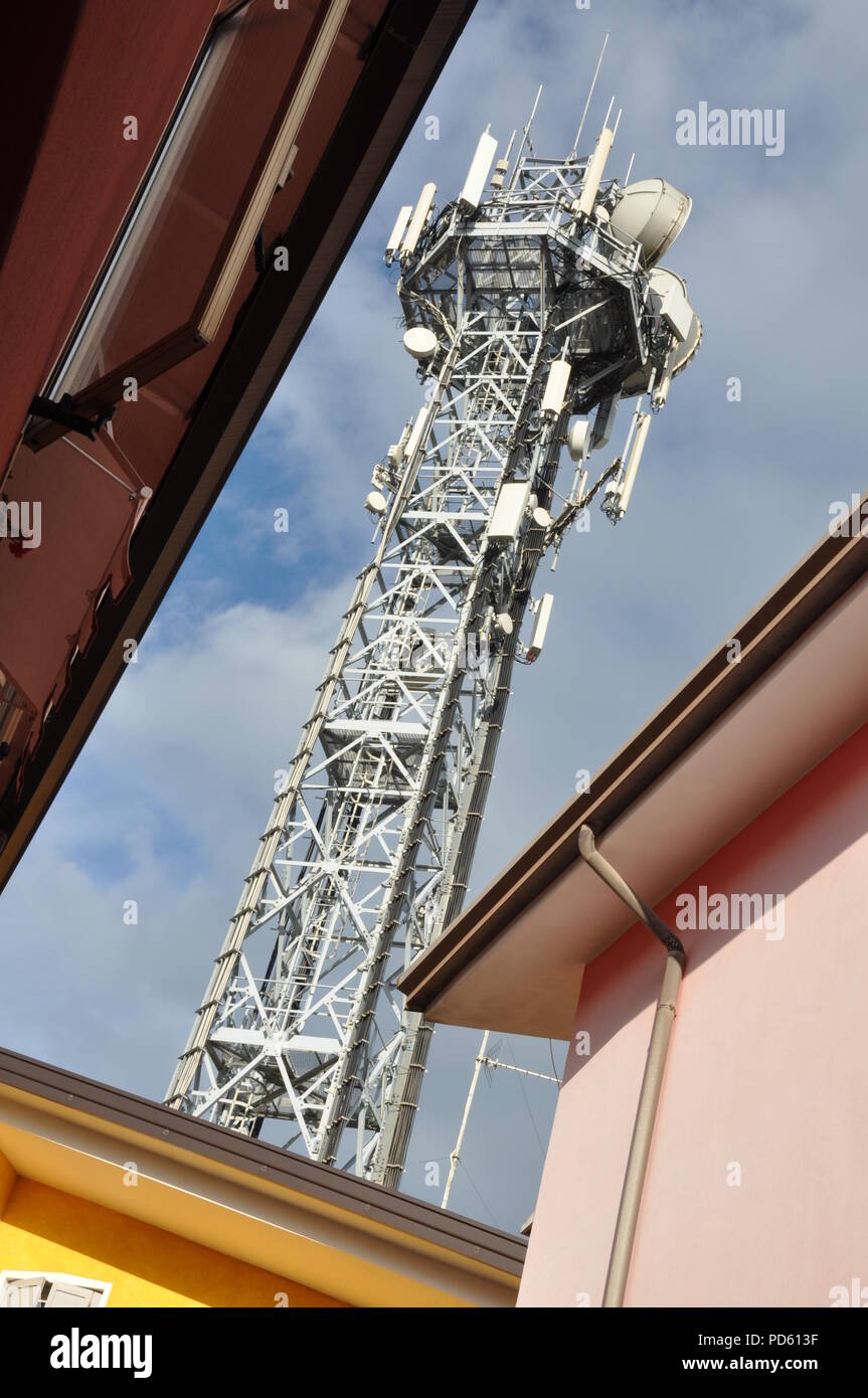 Telecommunication tower in urban space, communication technology Stock ...