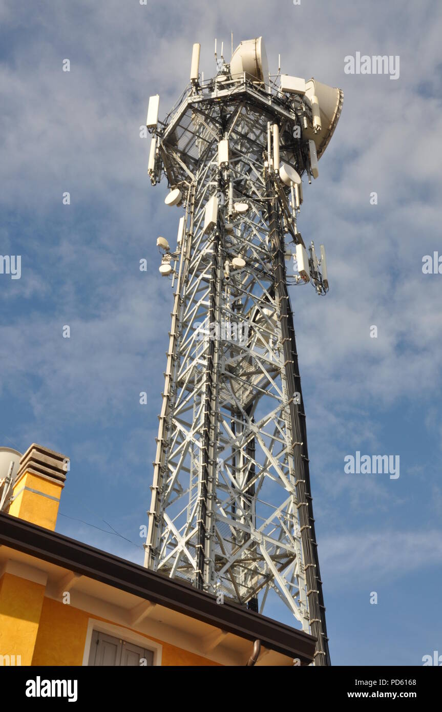 Telecommunication tower with antennas over the top of a building Stock ...