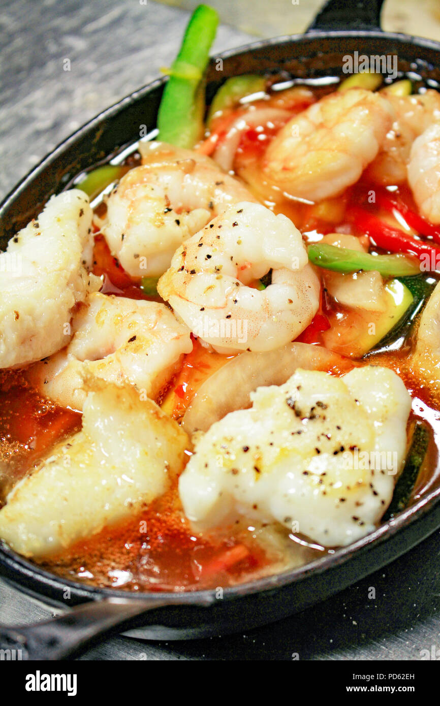 baked shellfish in sweet chili sauce Stock Photo - Alamy