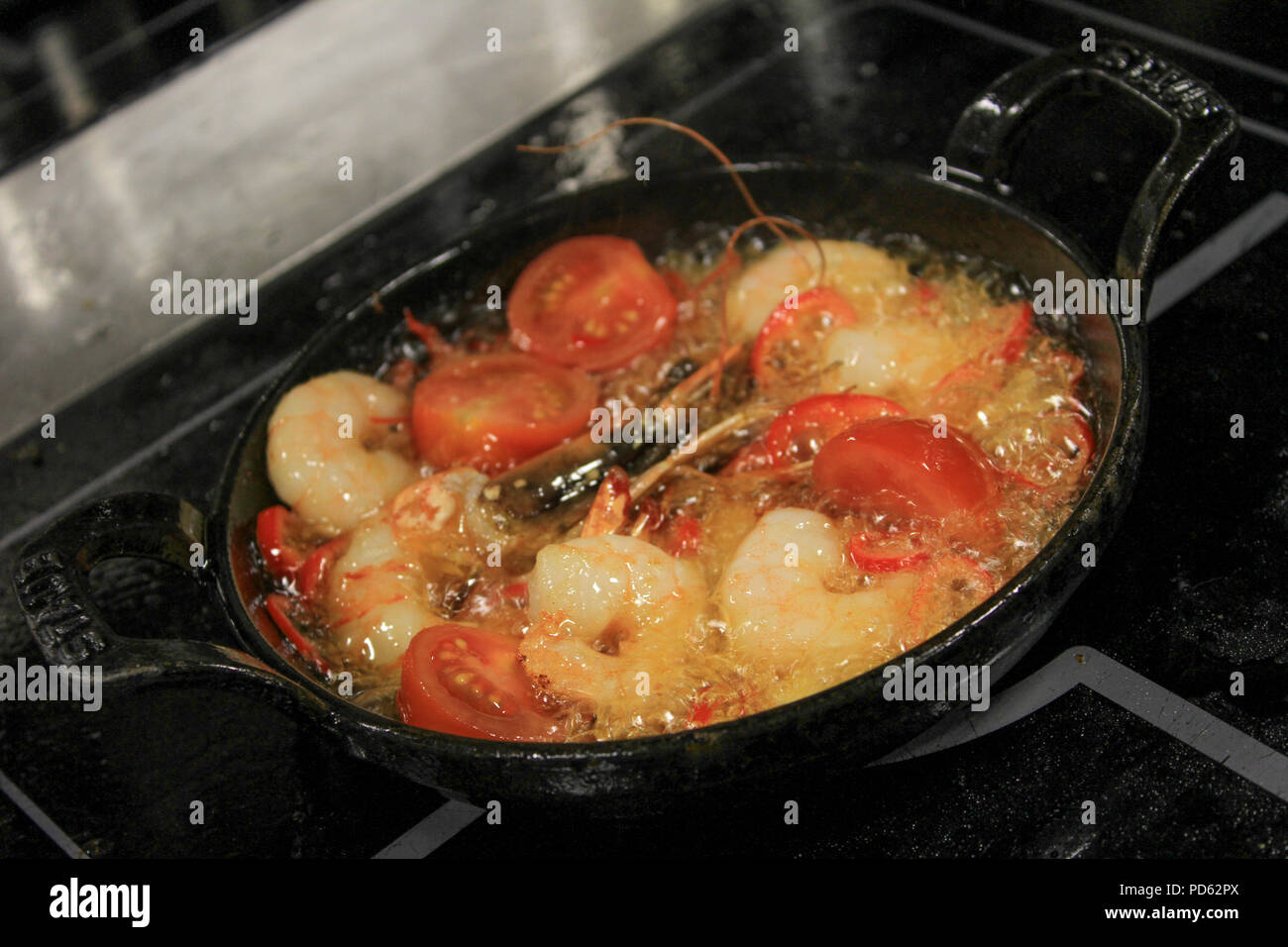 baked shellfish in sweet chili sauce Stock Photo - Alamy