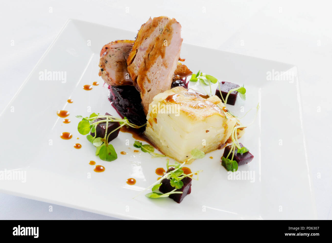 plated pork dinner Stock Photo - Alamy