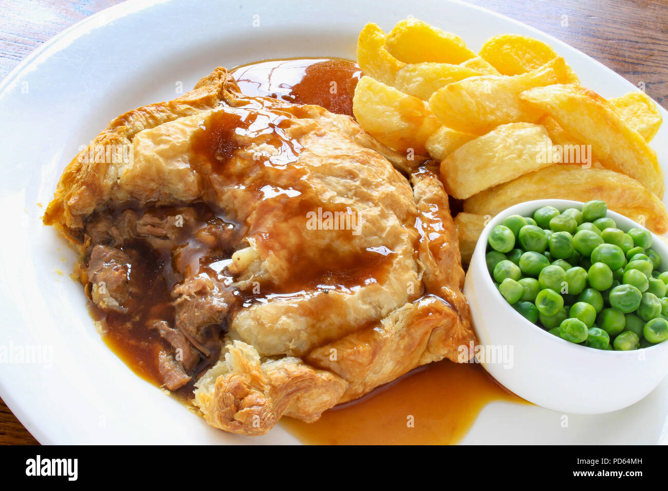 plated steak pie and chips dinner Stock Photo - Alamy