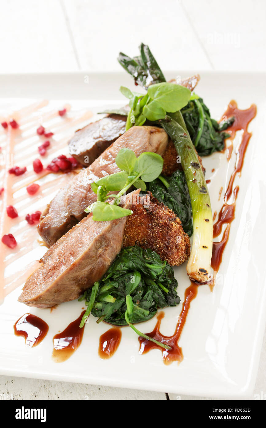 plated duck main meal Stock Photo - Alamy